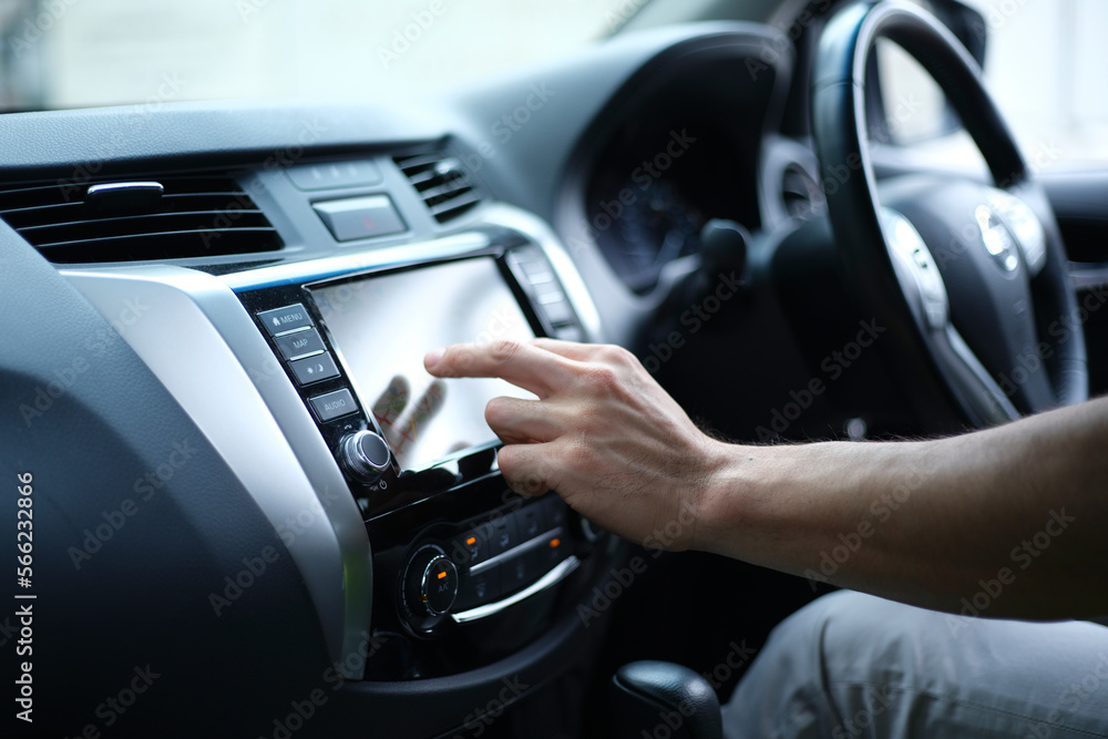 Arm of a person using car dashboard screen Stock Photo | Adobe Stock