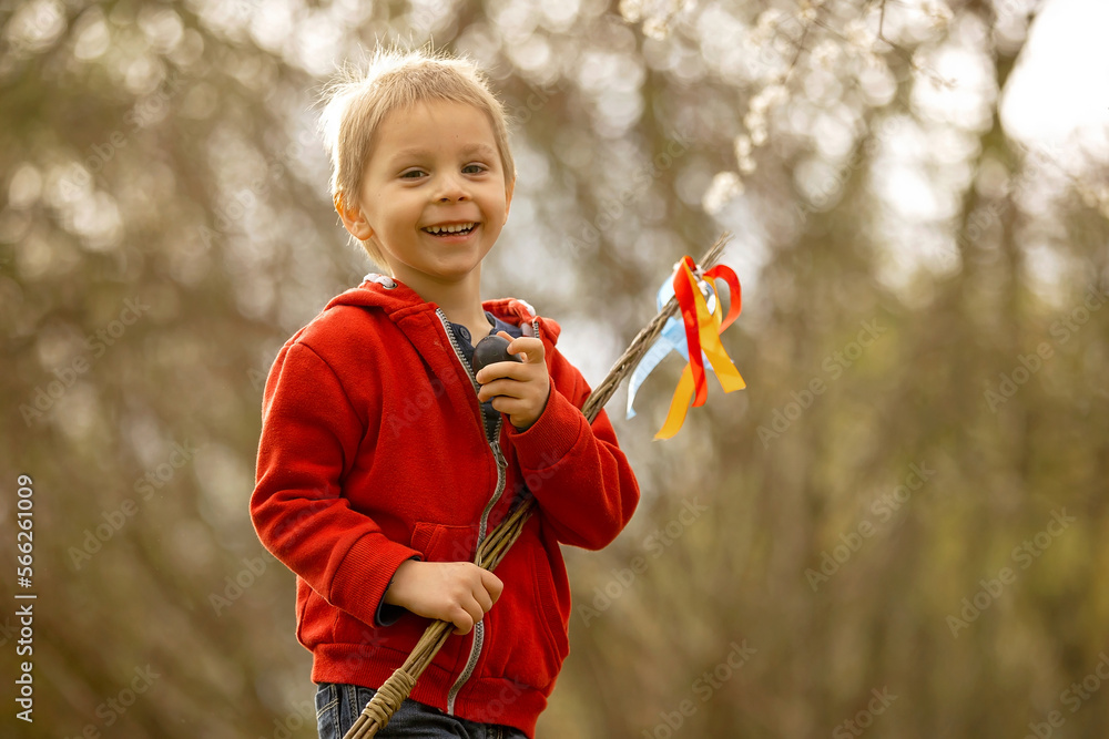 Cute preschool child, boy, holding handmade braided whip made from ...