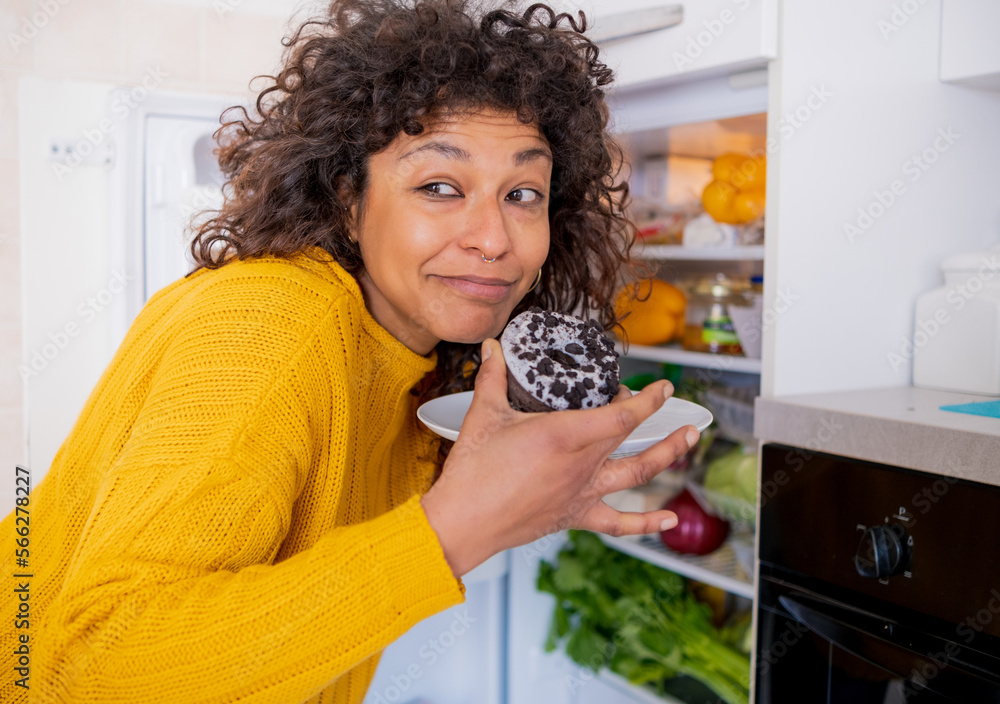 Black woman tempted by junk food addicted to sugar Stock Photo | Adobe ...