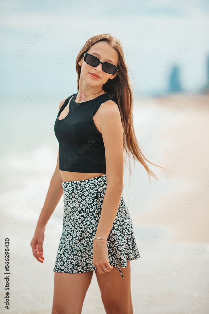 Beautiful teen girl on the beach during summer vacation Stock Photo ...