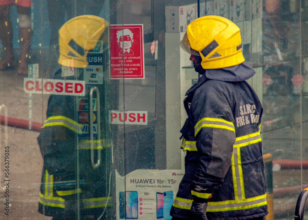 National Fire Fighter of Sri Lanka trying to fight a fire going on in a ...