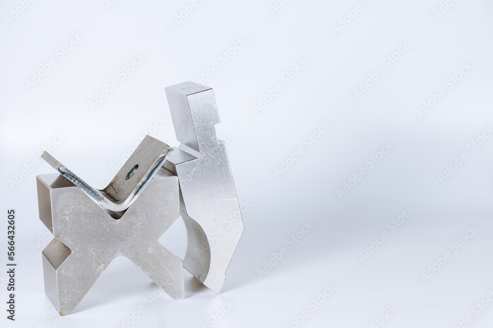 Equipment for bending sheet metal on a CNC bending machine on a white ...