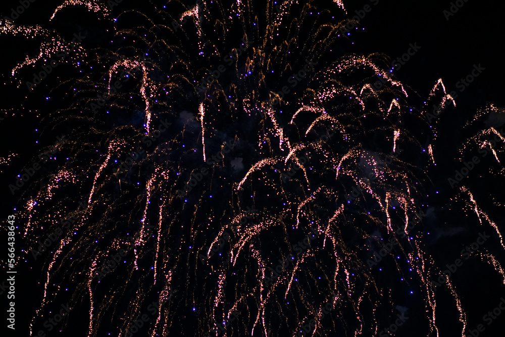 Huge fireworks explosions with Violet and golden colors over a party in ...