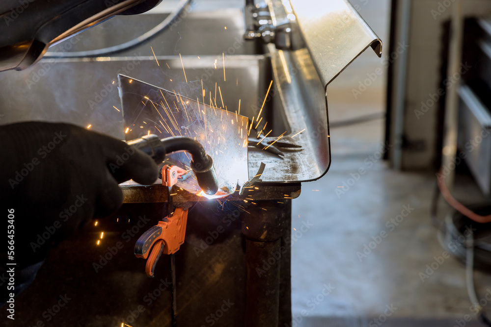 Worker working welding metal with sparkle using welding machine semi ...