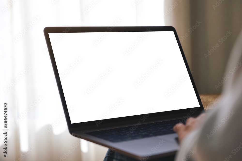 Mockup image of a woman working and typing on laptop computer with ...
