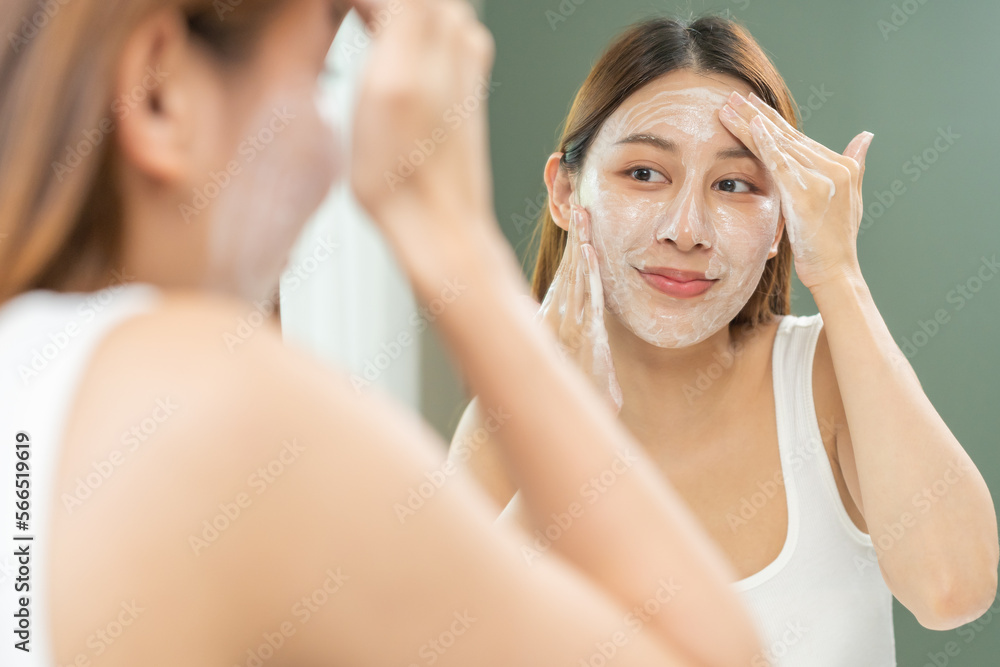 Cheerful asian young woman, beauty girl hand applying foam cleanser for ...