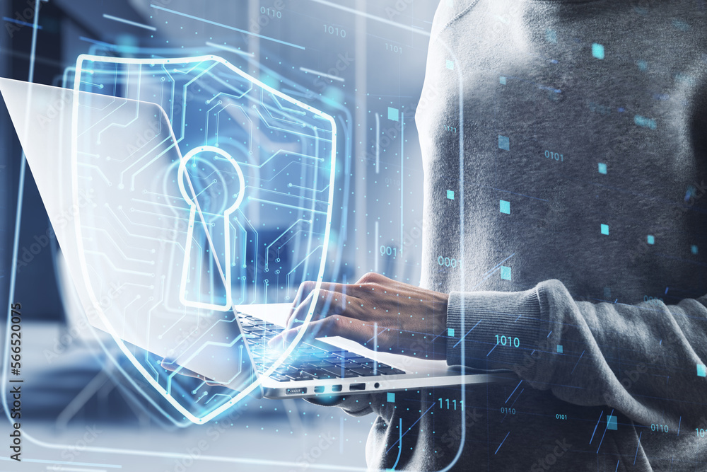 Close Up Of Hacker Hands Using Laptop With Glowing Padlock Hologram On