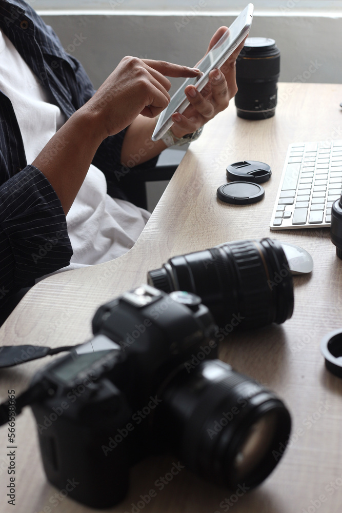 Side view and close up finger touching screen of tablet smartphone to ...