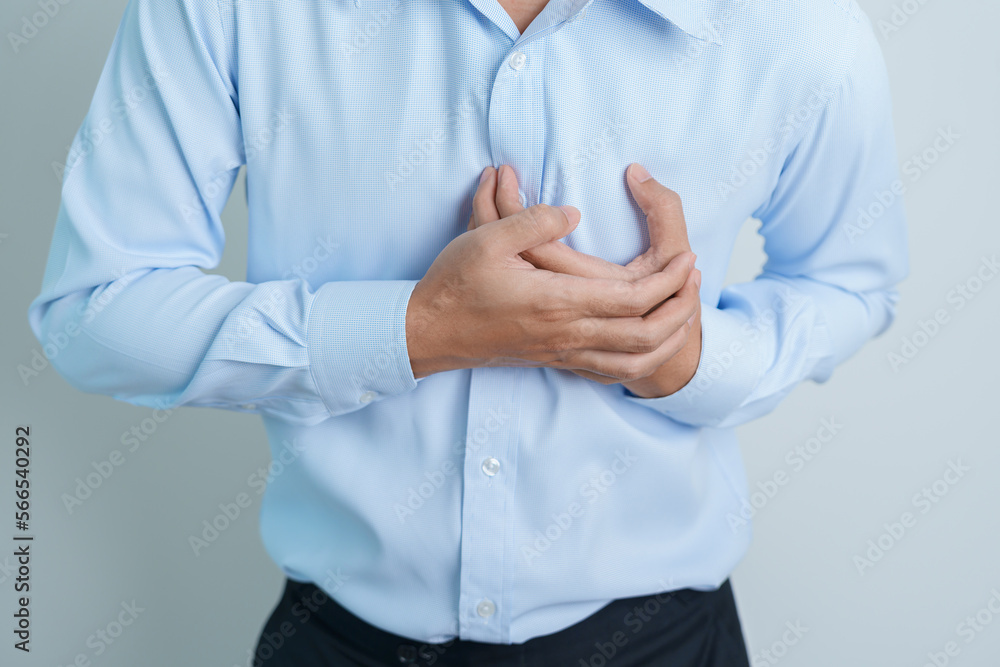 man hand holding chest ache. Heart disease, angina disease and symptom ...