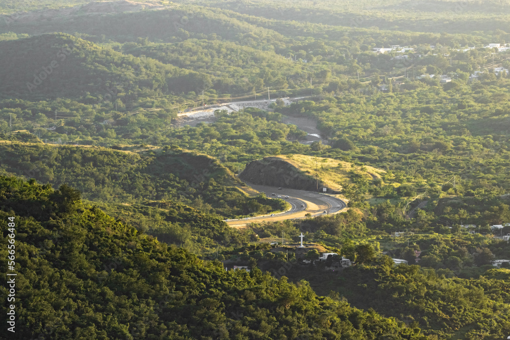 Top view landscape of a curved highway road with mountains in golden ...