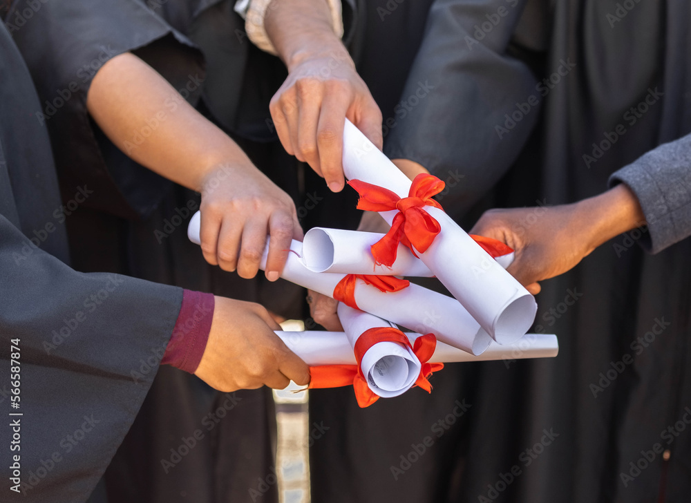 Graduation, graduate celebration and hands with diploma, together with ...