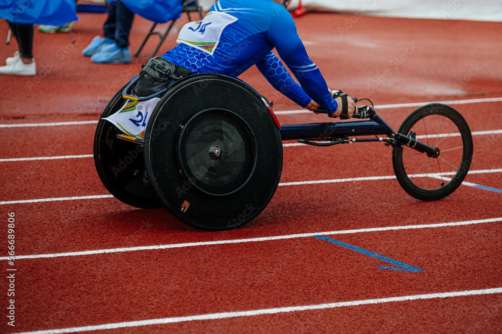male athlete in wheelchair racing competition at stadium Stock Photo ...