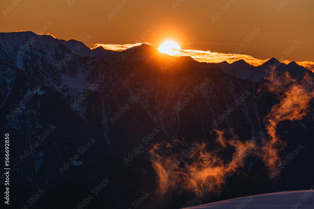 Sunset over the Italian alps of Valtellina, near the village of Sondrio ...
