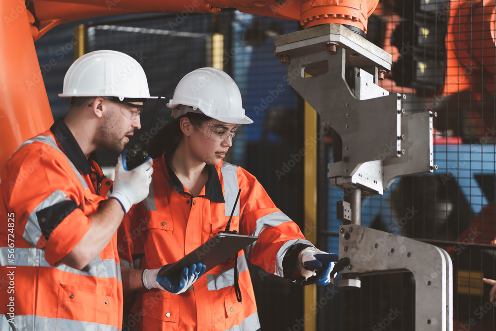 robotic arms. Engineer manager checking and controling automation robot ...