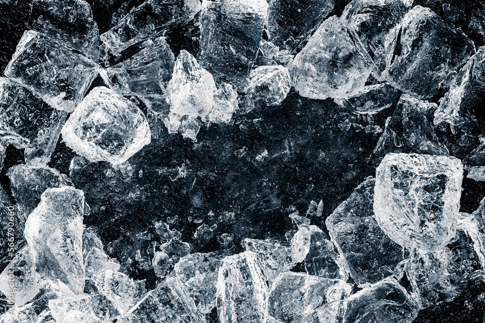 Ice cubes crush on black background. Chill backdrop. Frame border, in ...