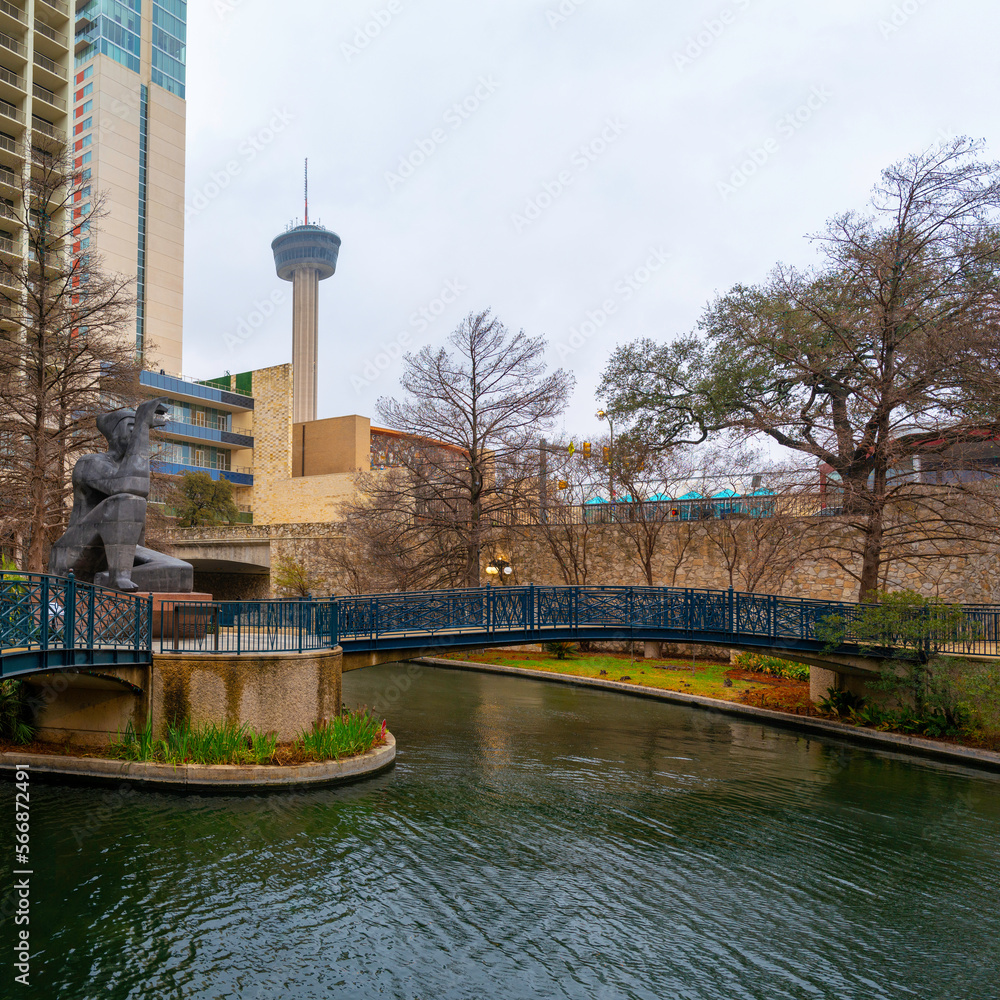 Tower of the Americas and the boardwalk bridge over the San Antonio ...