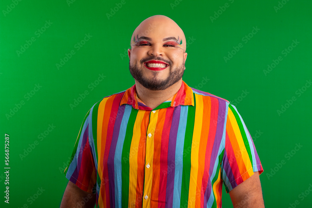 lgbt man with makeup and shirt with the colors of the gay movement flag ...