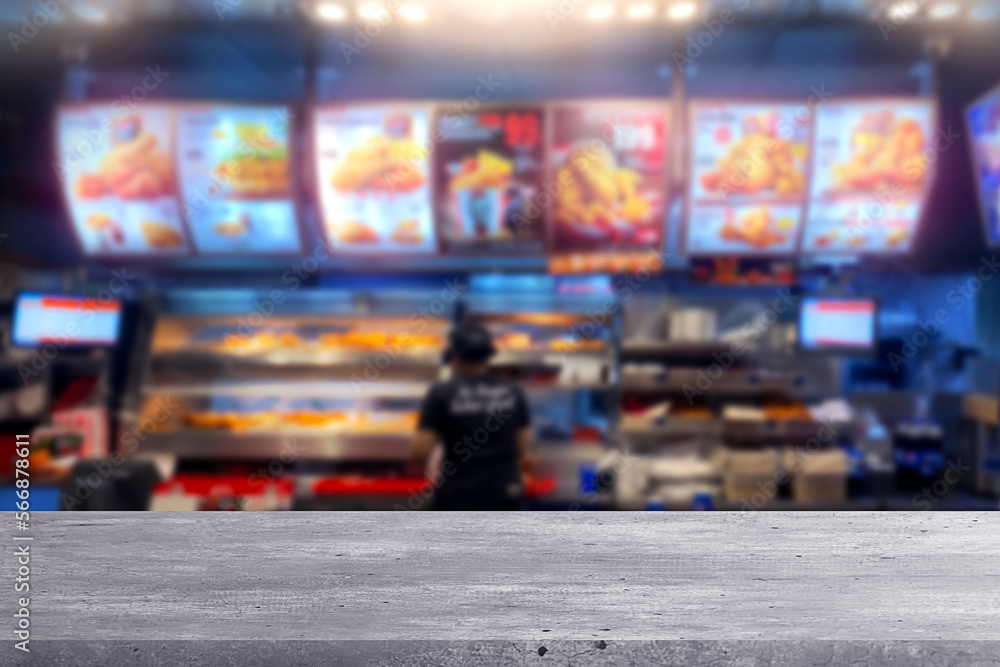 Modern wooden table with blurred fast food restaurant background. Has ...