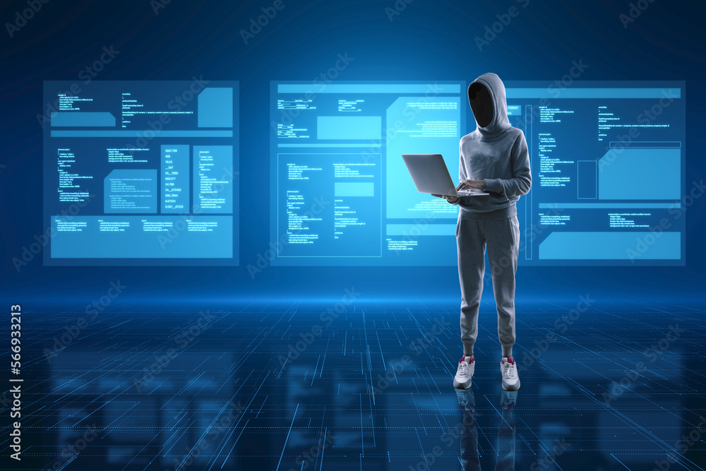 Hacker in hoodie using laptop with digital database folded on blurry ...