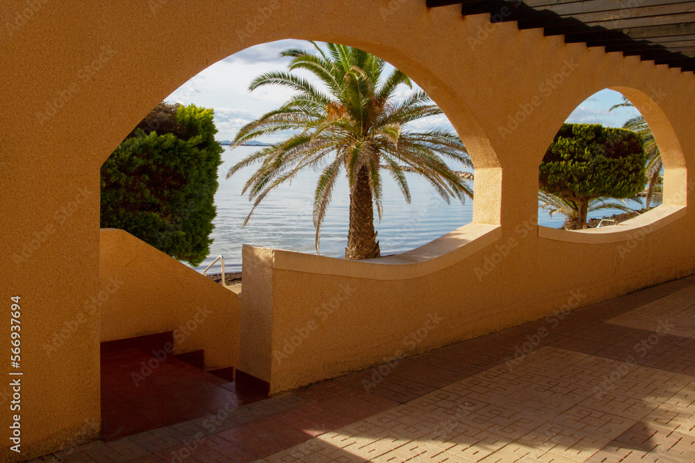 semicircular arch with round windows overlooking the sea Stock Photo ...