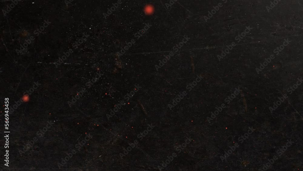 Slow motion of flowing fire sparks from left side on metallic rough ...