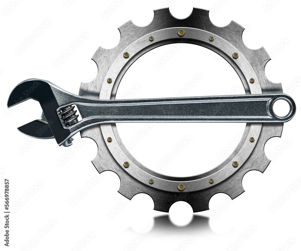 Closeup of a modern stainless steel adjustable wrench on a metal gear ...