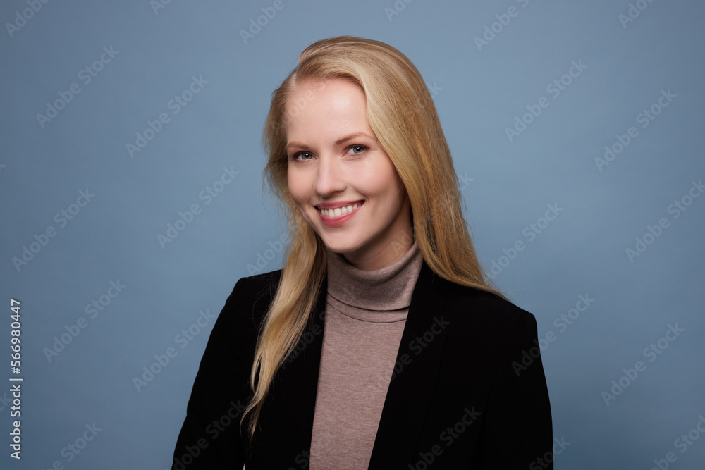 Business woman headshot in studio. A beautiful girl with a beaming ...