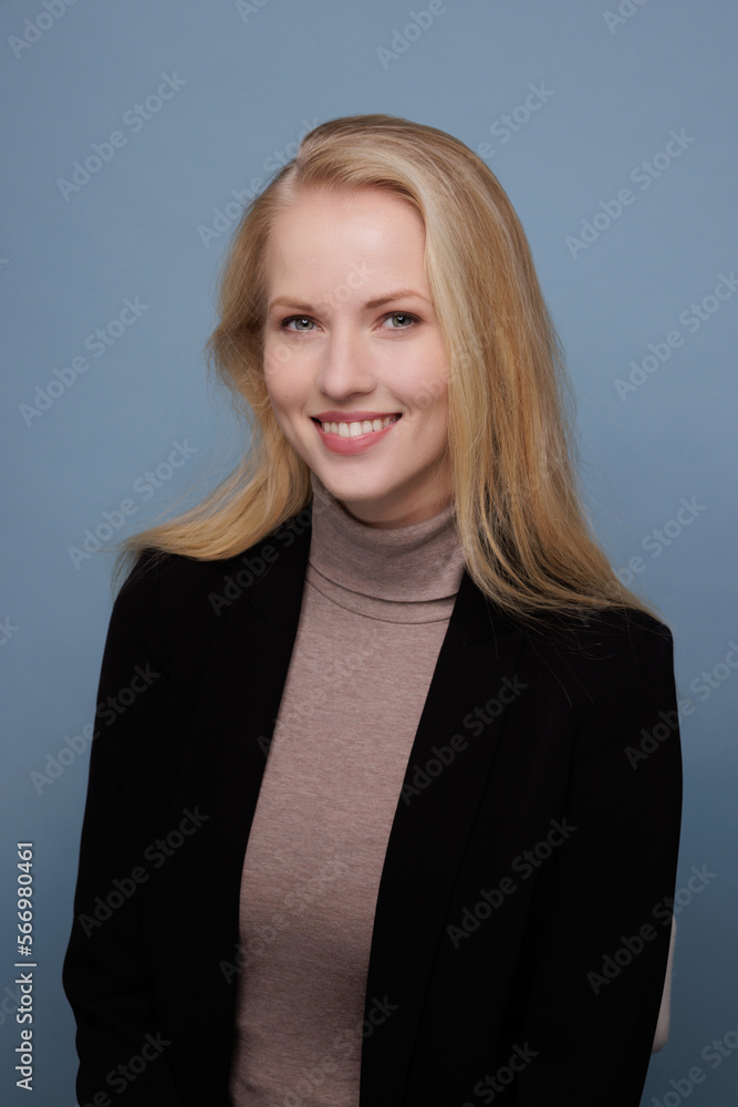 Business woman headshot in studio. A beautiful girl with a beaming ...