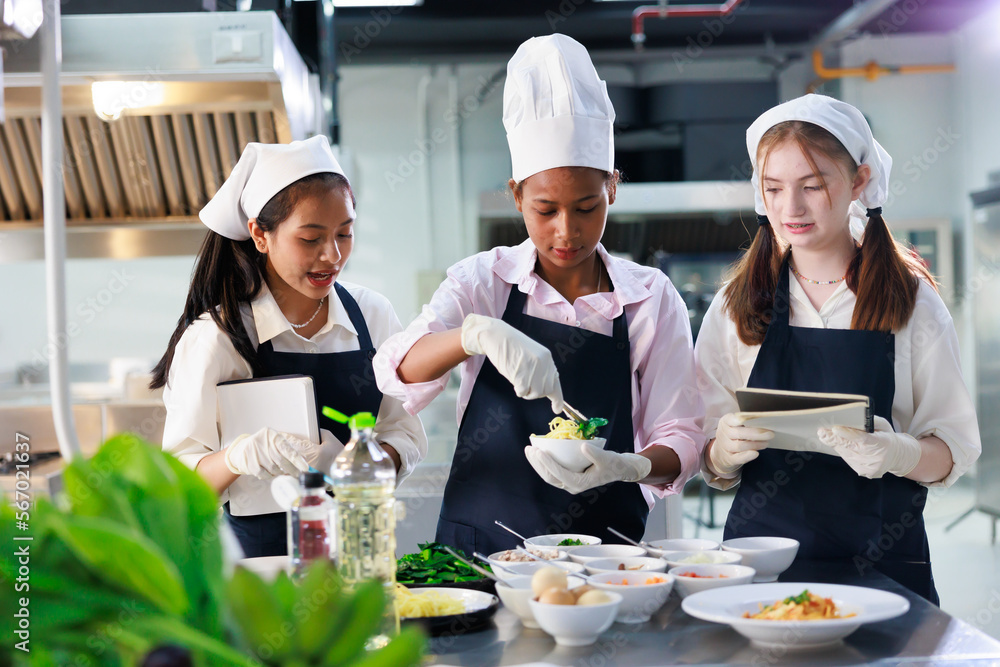 take note on book. Cooking class. culinary classroom. group of happy ...