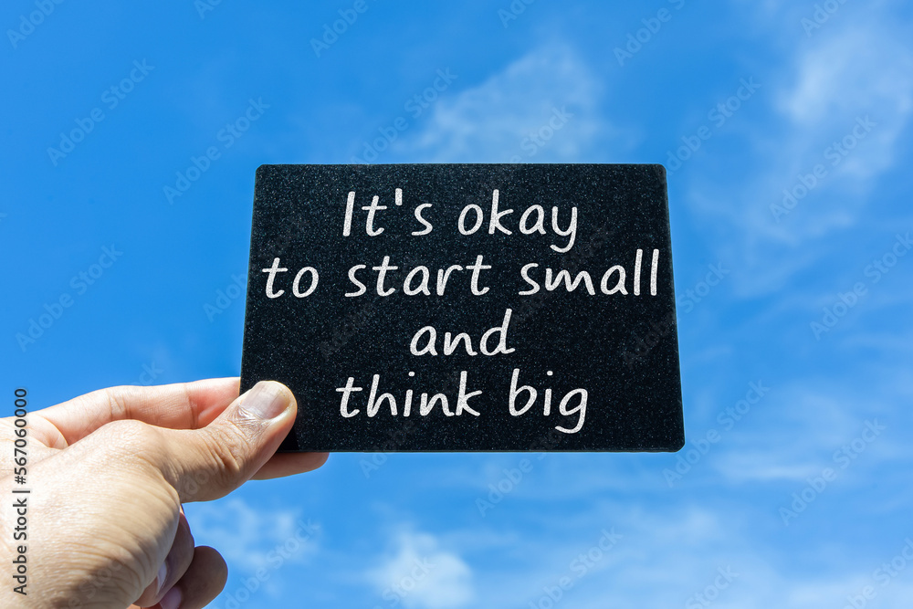 It's okay to start small and think big. Text on card with clouds and ...