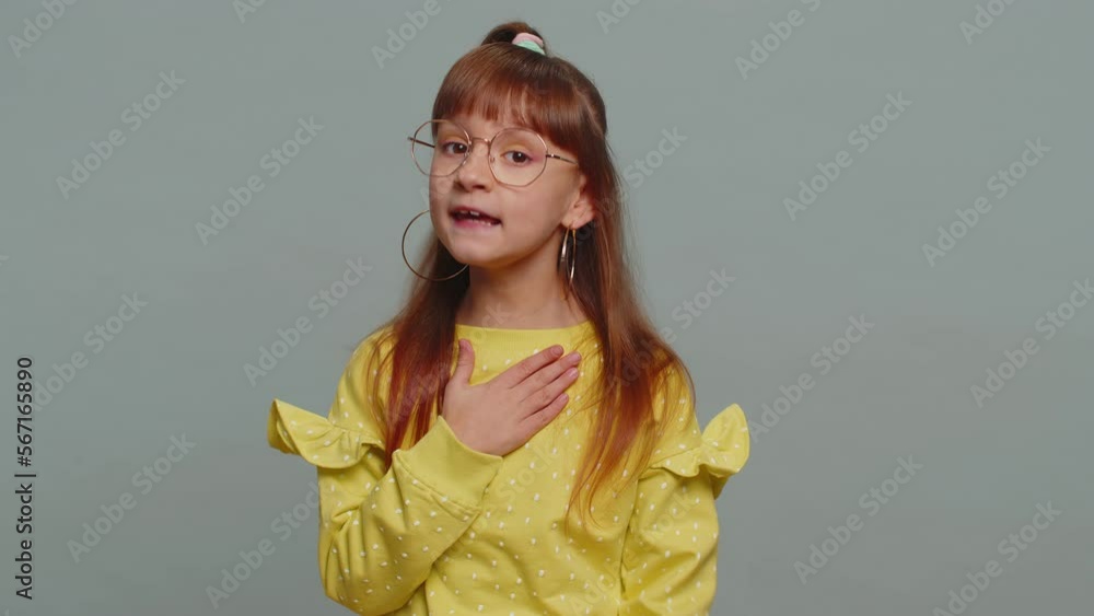 I am dont want it, not me. Confused toddler girl in glasses pointing ...