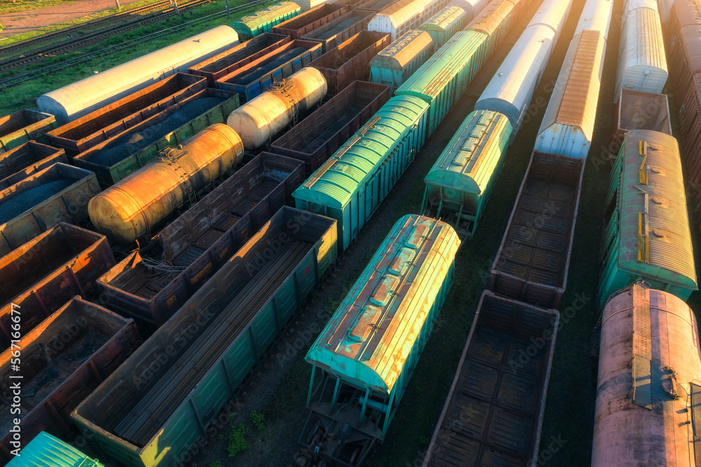 Drone view of freight trains at sunset. Railway cargo wagons with goods ...