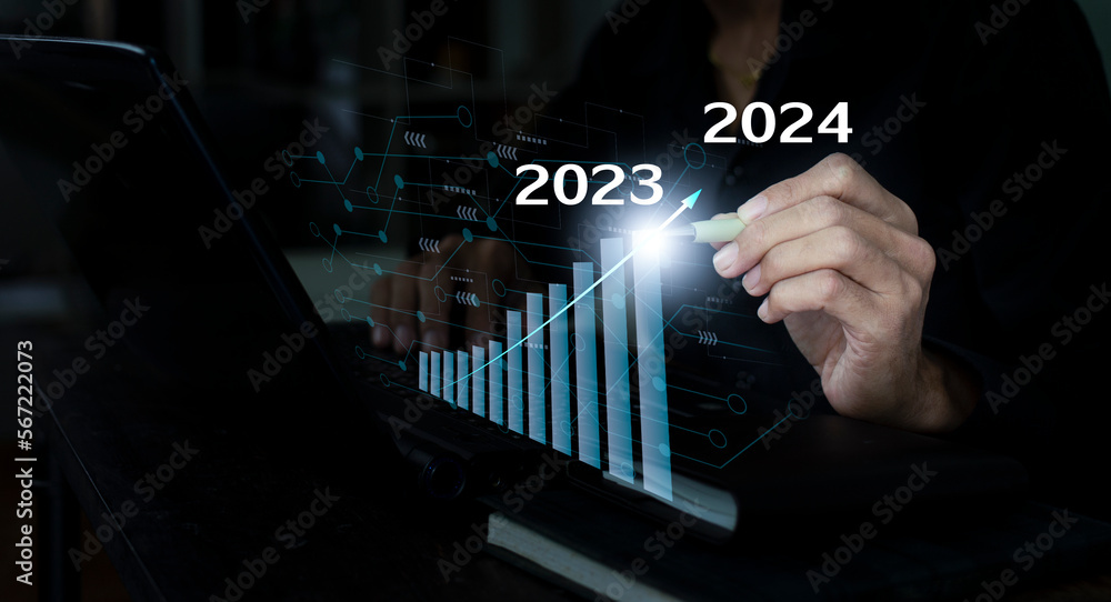 Businessman draw graph growth in year 2023,2024 with analyzing data ...