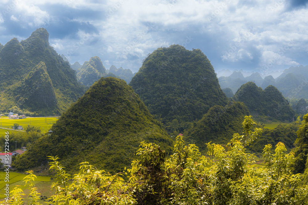 Dramatic sky above the sharp triangular limestone mountains between ...