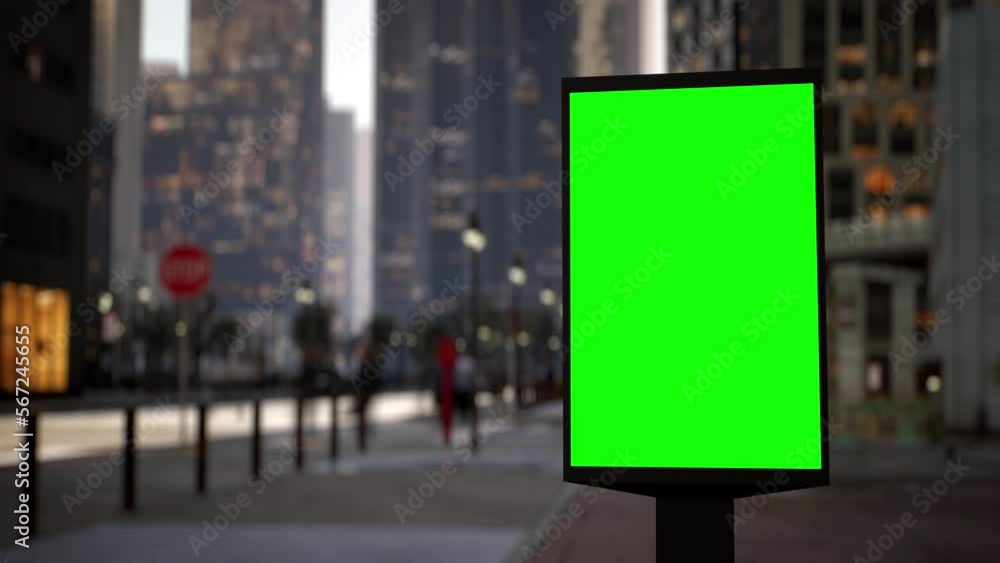 Modern billboard with a green screen for advertising on a busy ...
