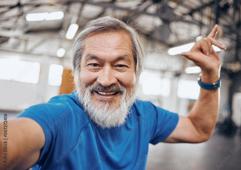 Foto de Fitness, selfie and portrait of Asian man in gym with hand sign for motivation, wellness ...