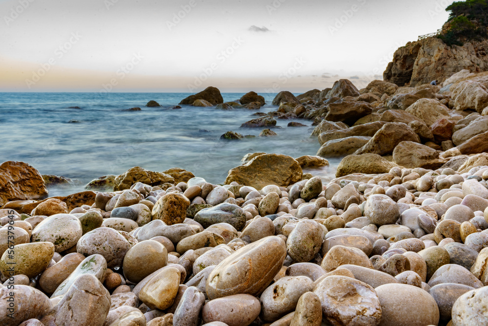 Huge rocky round rocks and stones against which the sea waves crash ...