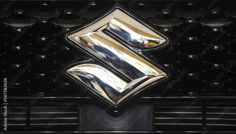 Suzuki metallic logo on Suzuki cars displayed at an auto show ...