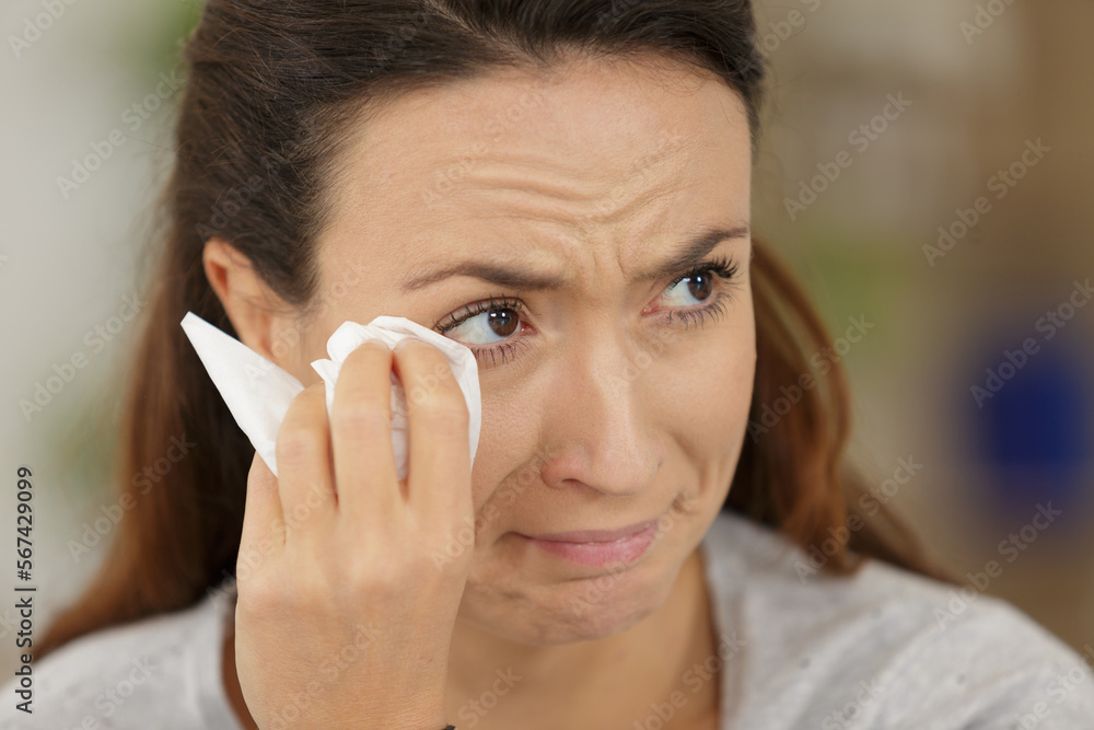 sad woman drying the tears Stock Photo | Adobe Stock