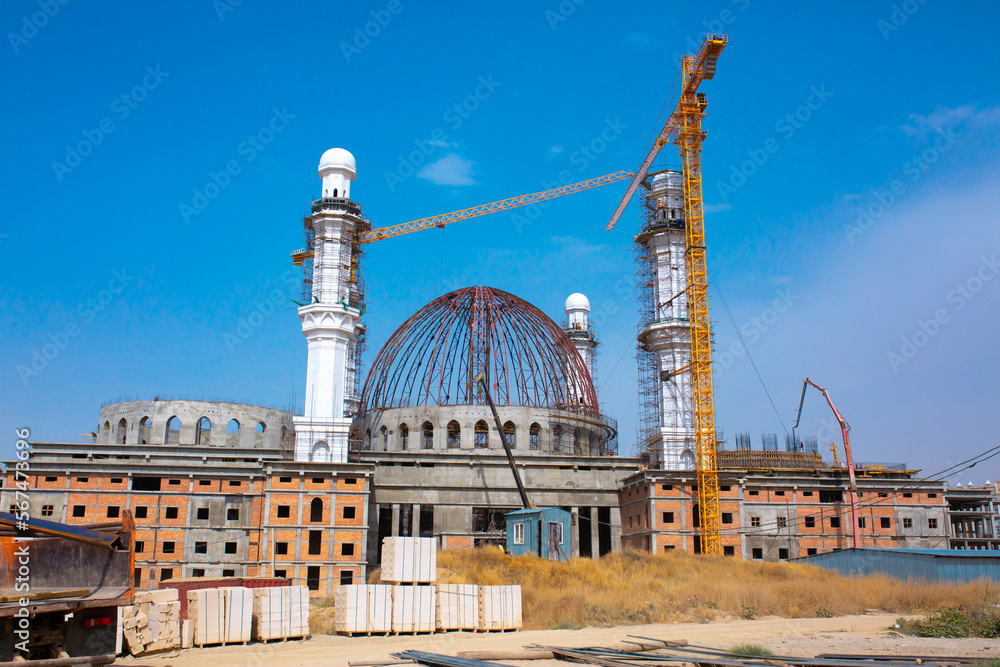 New Muslim Mosque under construction. Finishing work of minarets. Stock ...