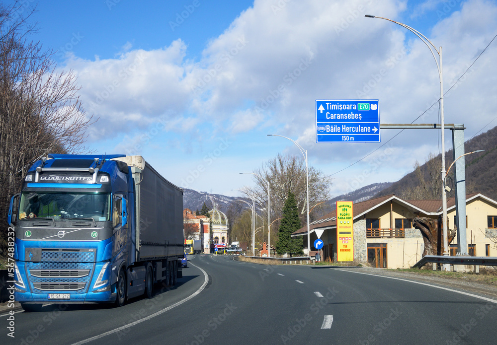 Foto de Volvo truck, goods carrier. Moving truck and road signs.Romania ...