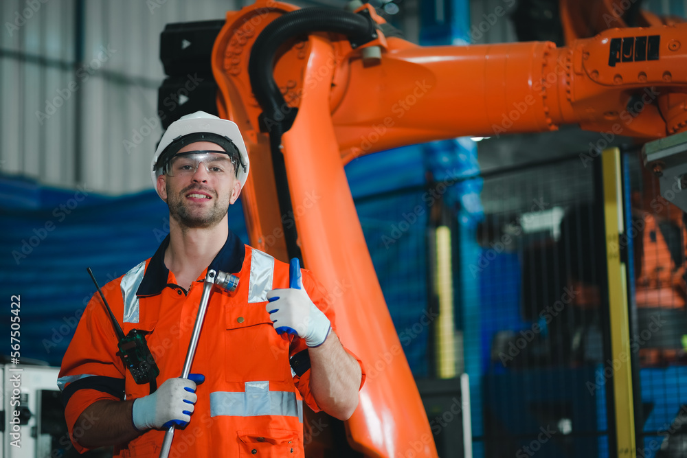 Robotic Arms Engineer Manager Checking And Controling Automation Robot Arms Machine In