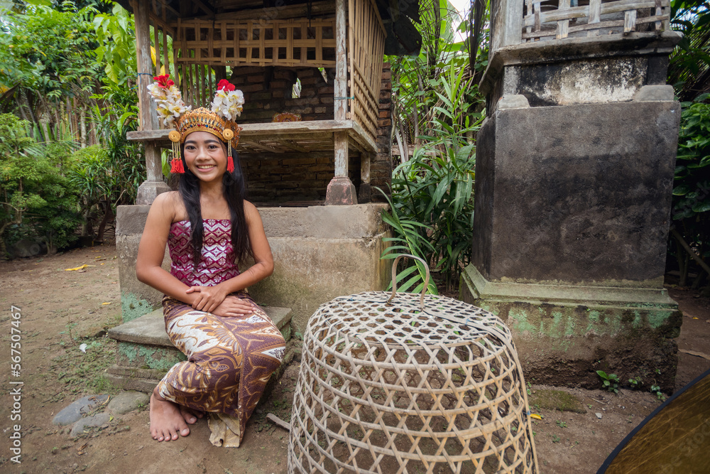 Portrait of a young balinese girl with a traditional gold crown, a old ...