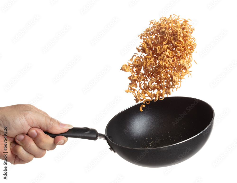 Instant Noodle fly in iron pan, yellow instant noodle float explode ...