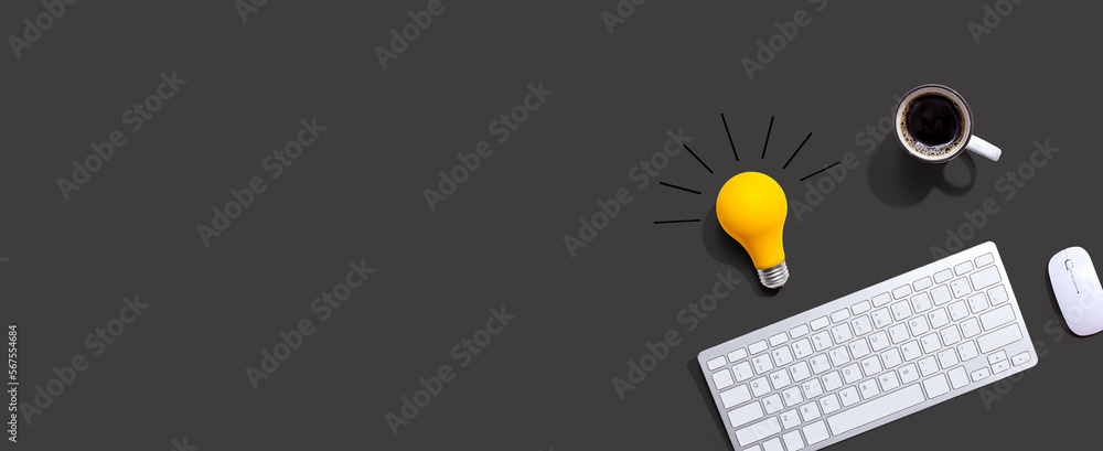 Computer keyboard with a yellow light bulb Stock Photo | Adobe Stock