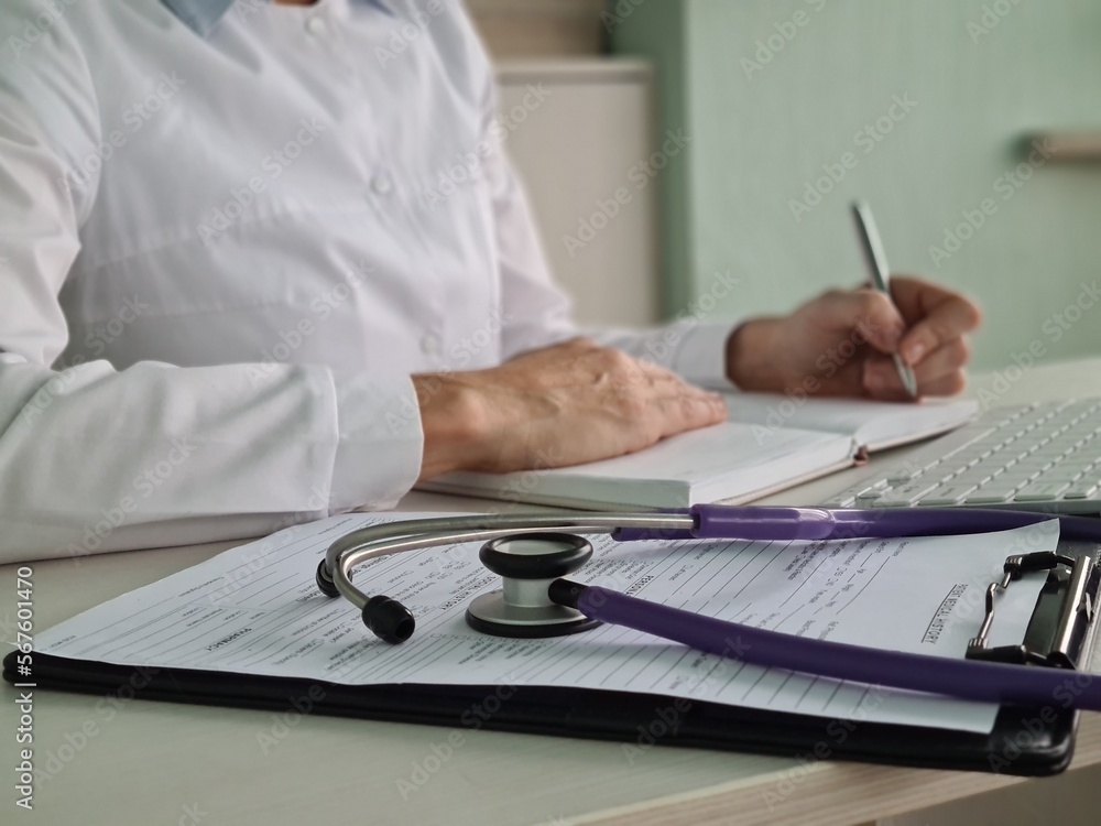 Doctor hand holding pen and notepad health insurance and education ...