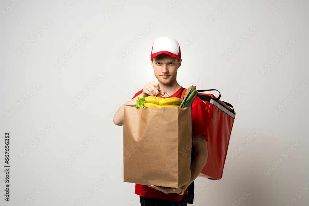 Delivery Concept Handsome Young Delivery Man Carrying Package Box Of delivery-concept-handsome-young-delivery-man-carrying-package-box-of