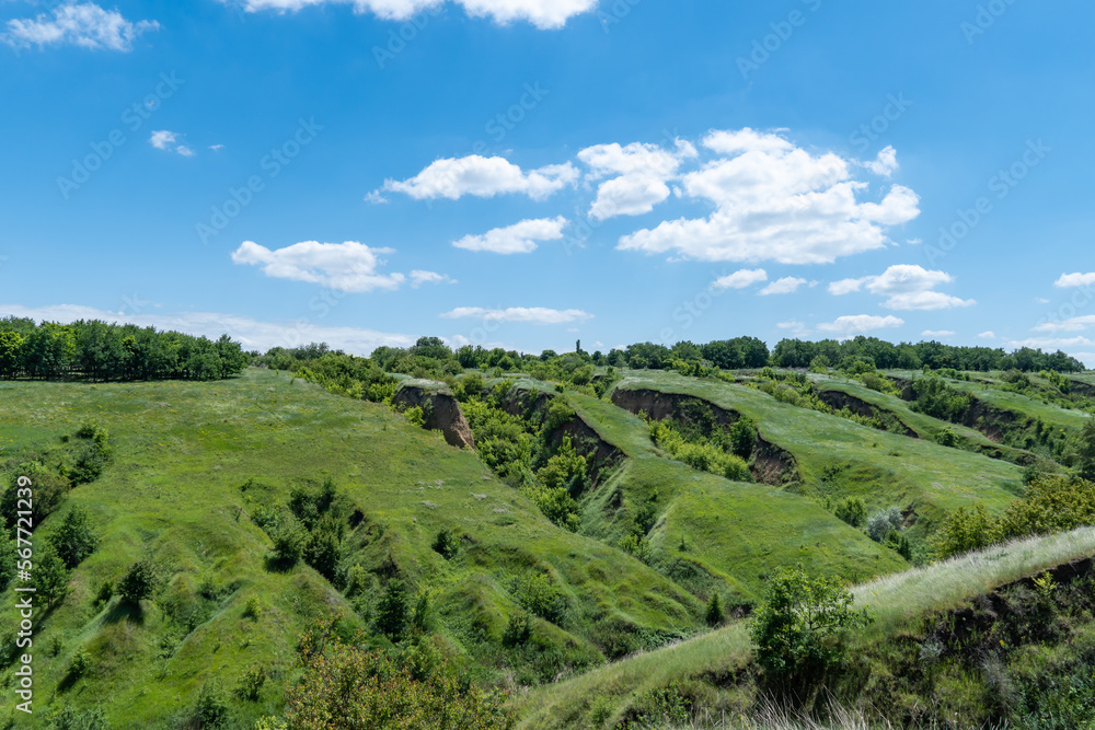 View ravine covered with greenery. Landscape valley with geological ...