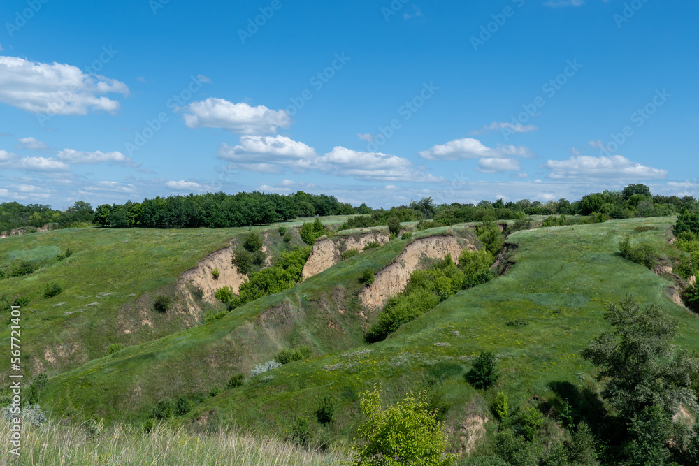 View ravine covered with greenery. Landscape valley with geological ...