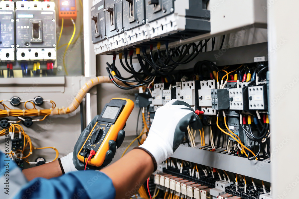 Electricity or electrical maintenance service, Electrician hand holding ...